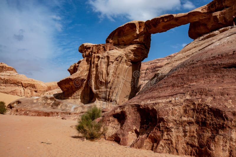 Jebel Burdah Rock Bridge in Wadi Rum Stock Photo - Image of dune ...