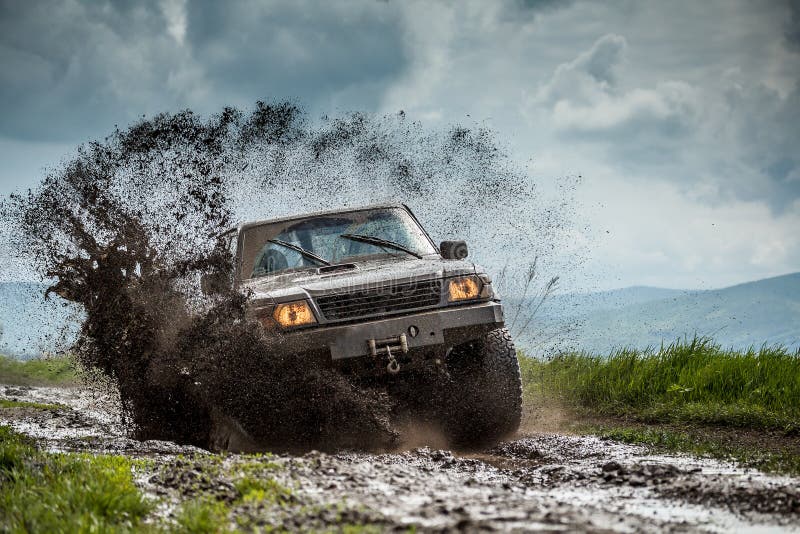 Off-road Vehicle in Muddy Terrain. Stock Photo - Image of muddy ...