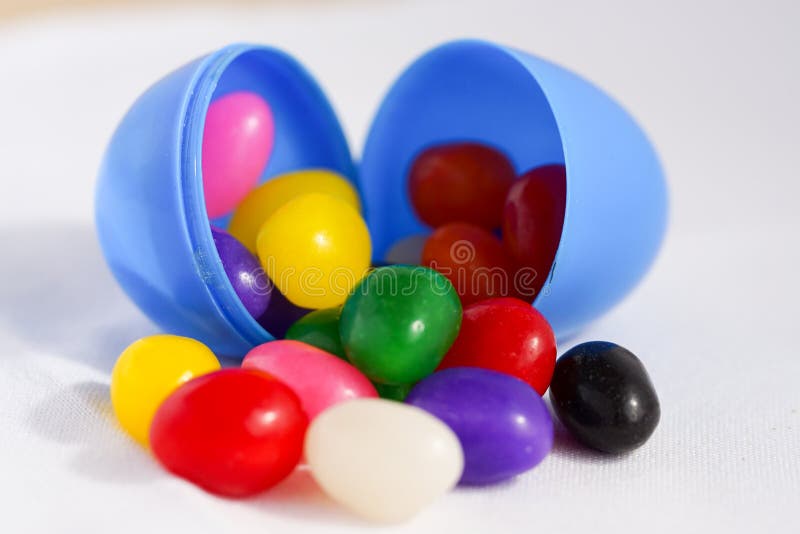 Jelly Beans Spill Out of a Plastic Easter Egg Stock Image - Image of ...