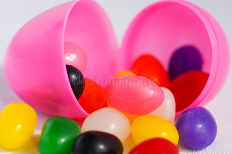 Jelly Beans Spill Out of a Plastic Easter Egg Stock Image - Image of ...