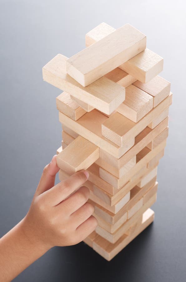 Jenga Hand Pulling Stock Photos - Free & Royalty-Free Stock Photos from ...