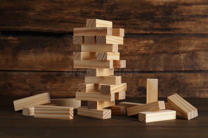 Jenga Tower and Wooden Blocks on Table Stock Photo - Image of gaming ...