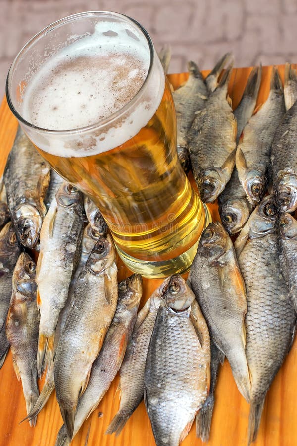 Jerked Dried Fish for Snack and Alcoholic Drink Beer with Foam Stock ...