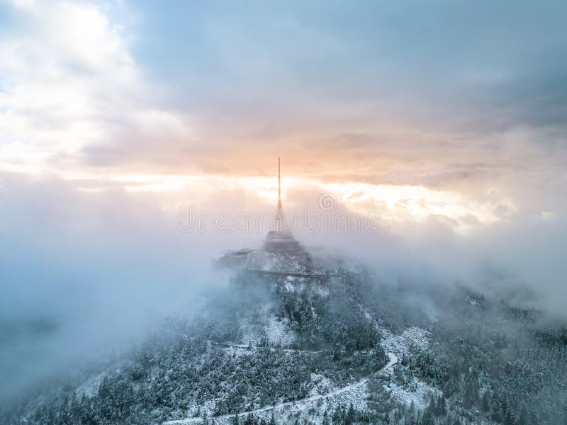 Jested Mountain in clouds stock image. Image of aerial - 298123147