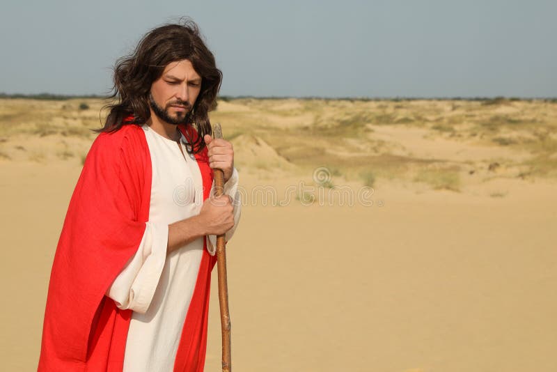 Jesus Christ Walking with Stick in Desert. Space for Text Stock Image ...
