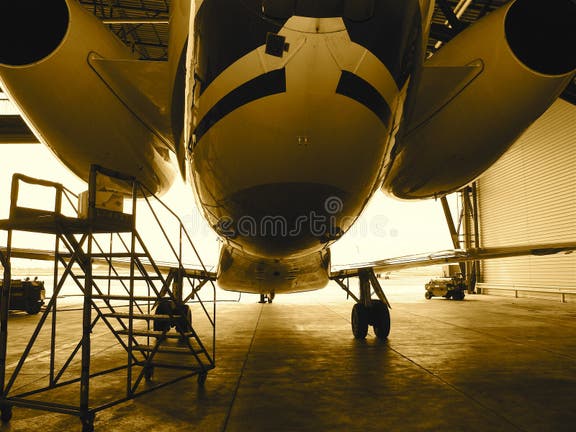 Jet airplane in hanger stock image. Image of engine, sepia - 7762451