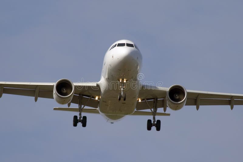 Jet airplane landing stock photo. Image of blue, aircraft - 7494298