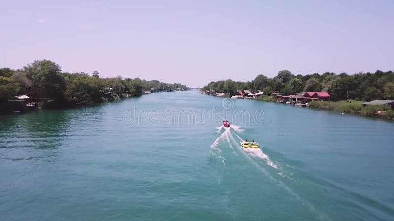 Jet Boat Pulling Two People on a River Stock Footage - Video of ...