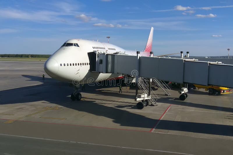 Jet Bridge Attached To a Passenger Plane in the Airfield Editorial ...