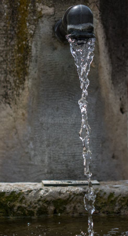 The Jet of Drinking Water from the Spring Crane Stock Image - Image of ...