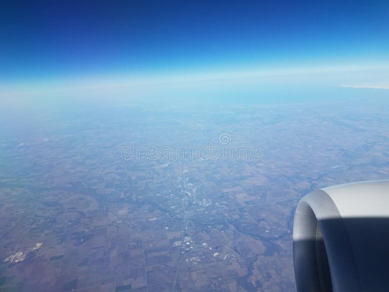 Jet Engine and Ground Seen from Airplane Window Stock Image - Image of ...