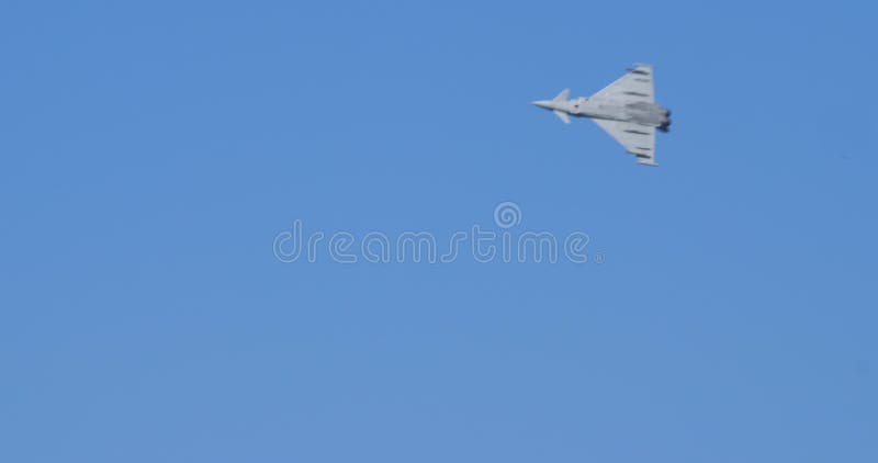 Jet Fighter Aircraft Does a Roll and Pull Up in a Blue Sky Stock Video ...