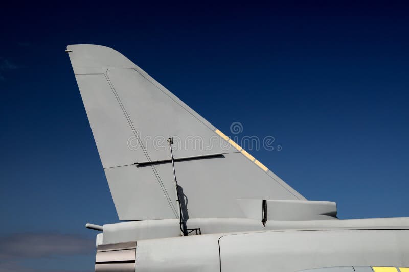 Jet Fighter Aircraft Tail Section Against a Clear Blue Sky Stock Image ...