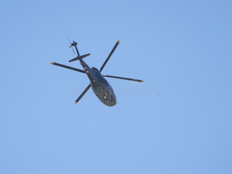 Jet Helicopter Passing Overhead Against Blue Sky Stock Photo - Image of ...
