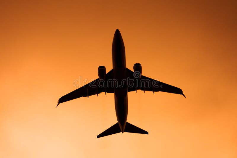 Jet Passenger Airplane Flying on Orange and Yellow Sunset Sky, Stock ...