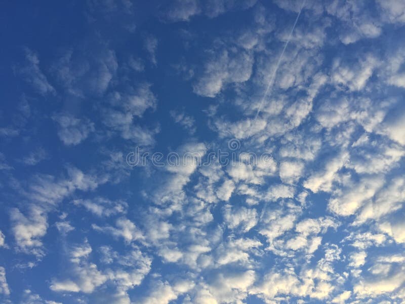 Jet plane in clouds stock photo. Image of light, bright - 96310558