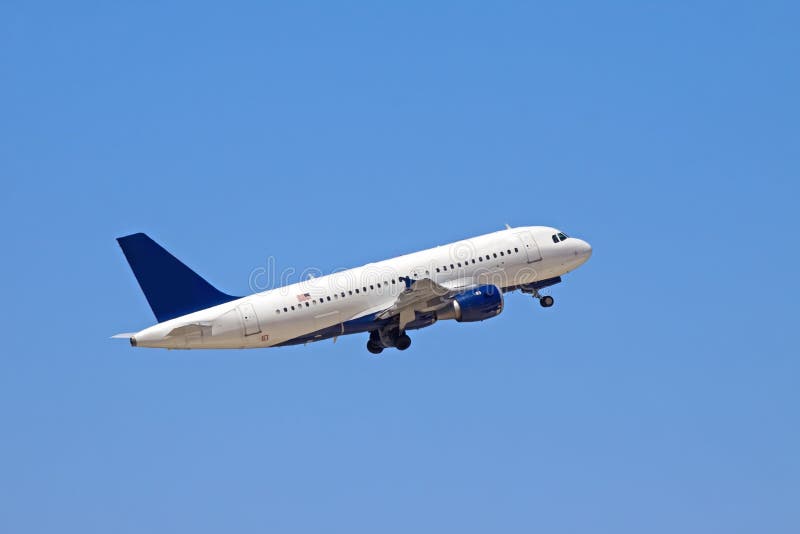 A Jet Plane Flying into a Blue Sky Stock Image - Image of ...