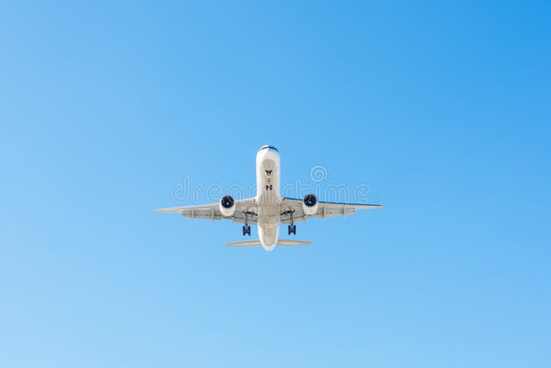 Jet Plane Flying in Blue Sky, Approach for Landing Stock Image - Image ...