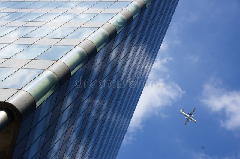 Jet Plane Flying Low Over Commercial Office Building Stock Image ...