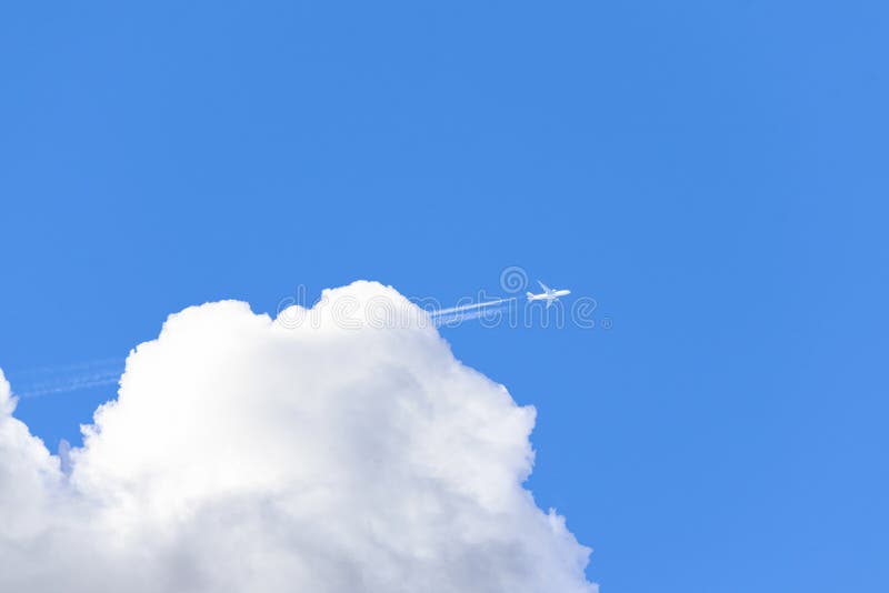 Jet Plane Flying Out of the Clouds Stock Photo - Image of vapour ...