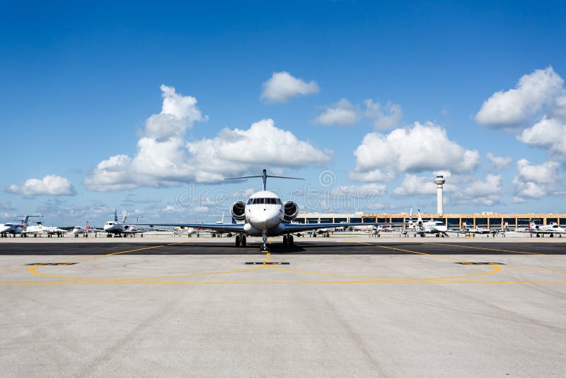 Jet Plane Sits on Tarmac at Airport Row of Planes Behind it Stock Image ...