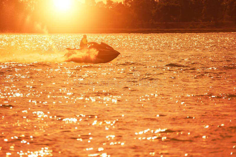Jet Ski is on the Sea Water and Sunset Stock Photo - Image of motor ...
