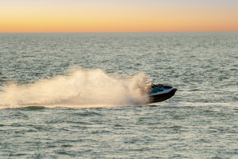 Jet Skiing in Darwin Harbour at Sunset Stock Photo - Image of sport ...