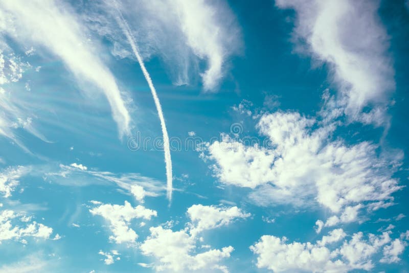 Jet smoke and blue sky stock photo. Image of airliner - 73882946