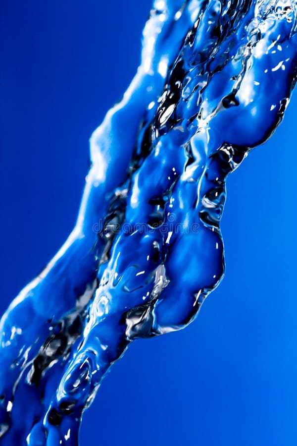 A Jet of Water on a Blue Background Stock Image - Image of blue, bubble ...
