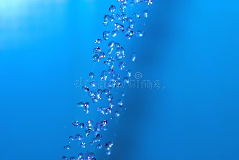 Jet of Water Over Blue Background Stock Image - Image of abstract, blue ...