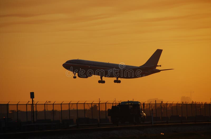 Jetliner landing at dawn stock image. Image of transport - 3276993