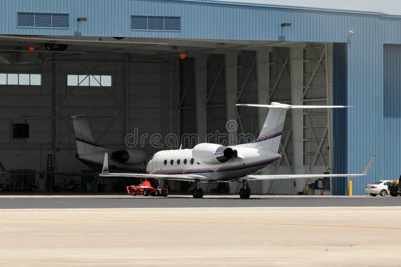Two Private Jets by Hangers Stock Photo - Image of open, luxury: 33895242