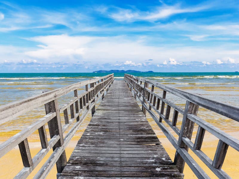 Jetty at Beach with Blue Sky Stock Photo - Image of ocean, tropical ...