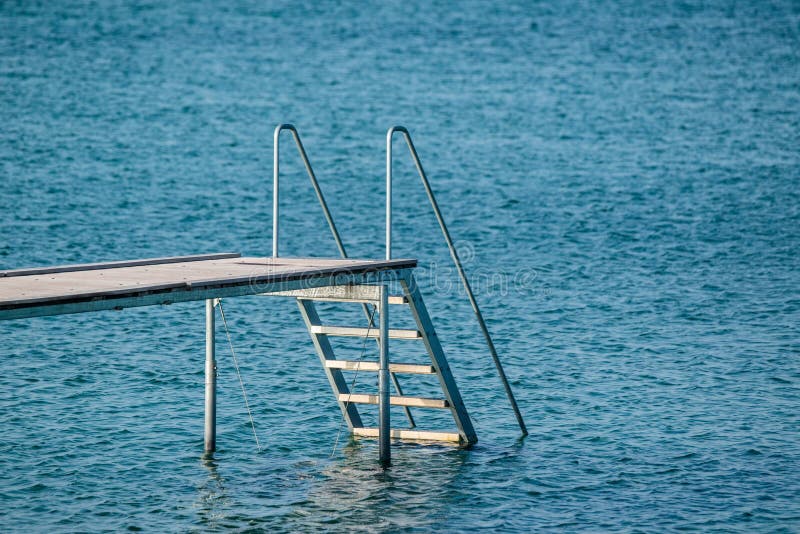 Jetty at a blue ocean stock image. Image of morning, dock - 61421381