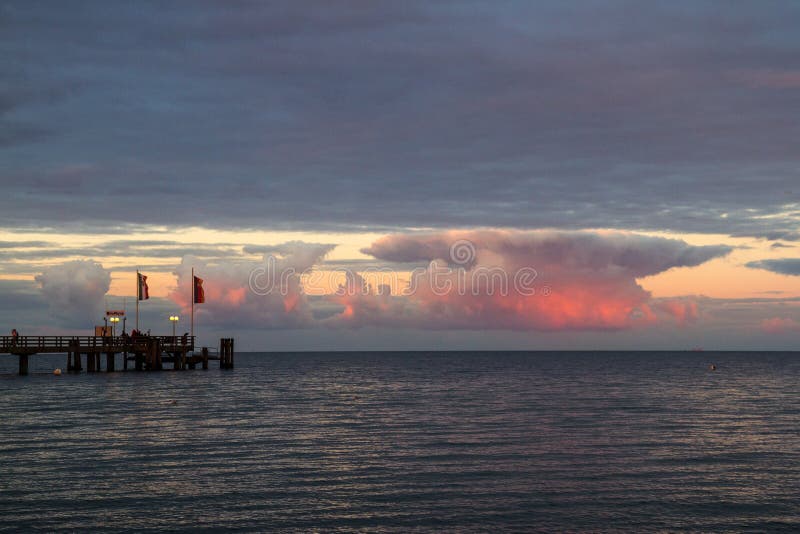 Jetty in Front of Clouds by the Sea Stock Photo - Image of lake ...
