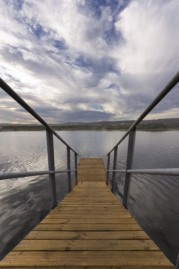 Jetty Going Down To River or Lagoon Stock Photo - Image of peaceful ...