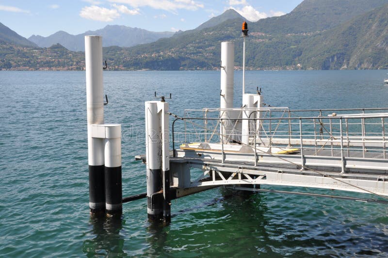 Jetty on lake Como stock image. Image of reflection, coast - 79716033