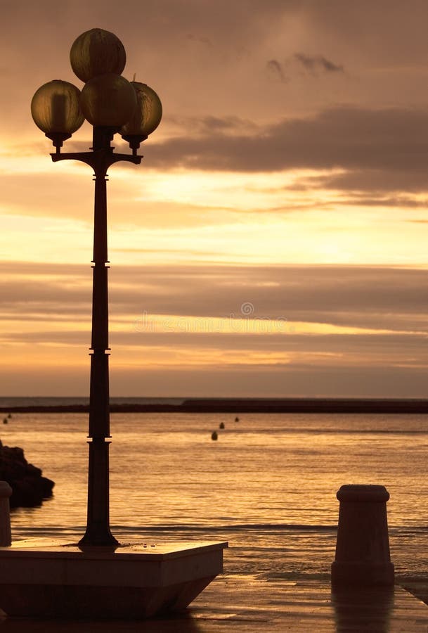 Jetty at Sunset stock image. Image of night, lamp, urban - 1793641