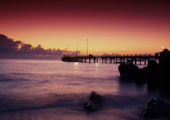 Jetty at sunset stock photo. Image of rocks, night, beach - 874906