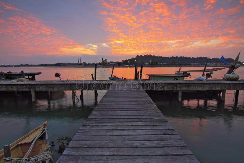 Jetty at sunset stock photo. Image of ships, night, boardwalk - 83062102