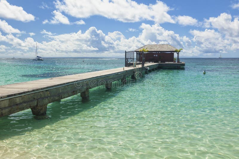 Jetty at tropical resort stock photo. Image of coast - 345290726