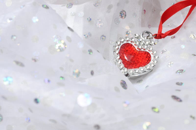 Red Jewel Box Heart Shaped Gift Present on Green Fabric Wavy Cloth ...