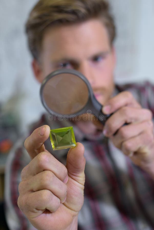 Jeweler Looking at Diamond through Loupe To Inspect it Stock Image ...