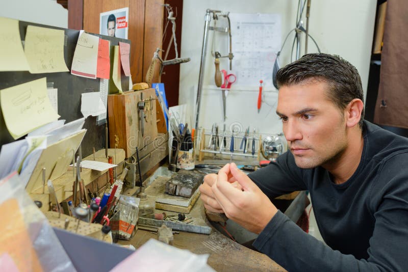 Jeweller hard at work stock photo. Image of creativity - 130820610
