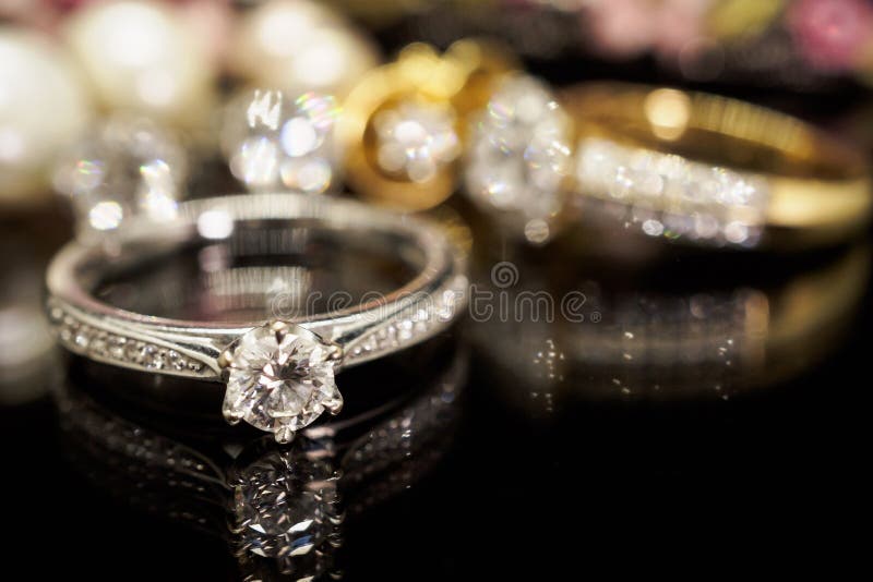 Jewelry Diamond Rings with Reflection on Black Stock Image - Image of ...