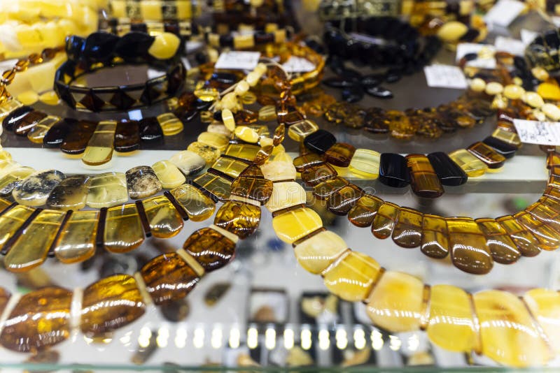 Jewelry Made of Amber. Natural Amber on the Table Stock Image - Image ...