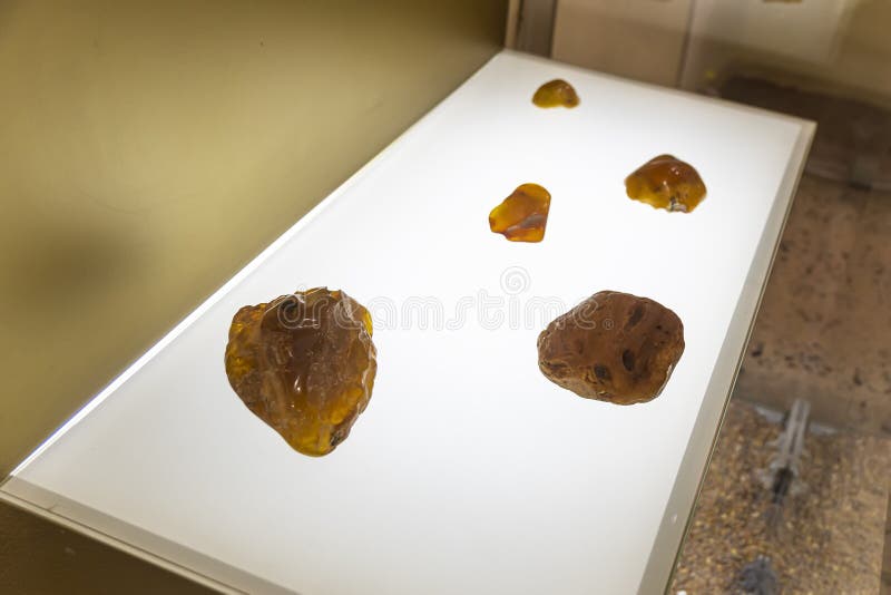 Jewelry Made of Amber. Natural Amber on the Table Stock Image - Image ...