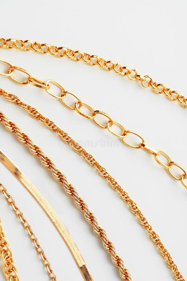 Jewelry Set of Golden Chains on the White Background Stock Photo ...