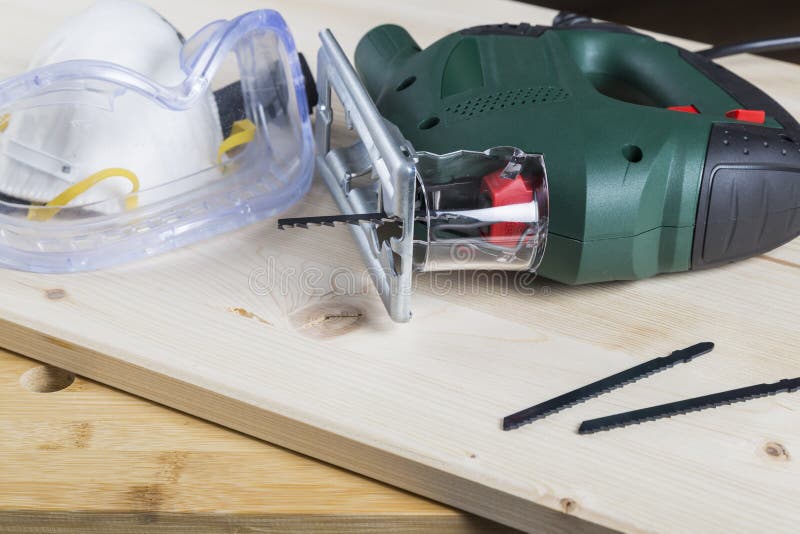 Jig Saw with Goggles and Mask on a Bench Stock Photo - Image of wooden ...