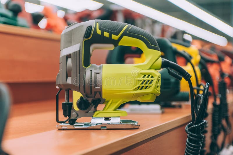 Jigsaw for Cutting. Concept Man Selects a Product in a Hardware Store ...